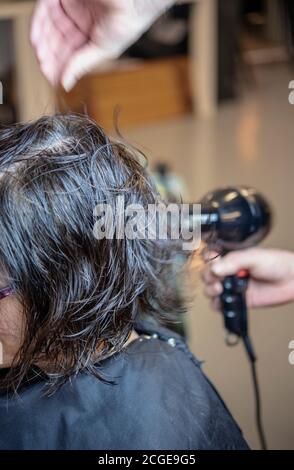 woman drying hair in hair salon. beauty shop Stock Photo - Alamy