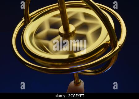 Gyroscope balancing on a finger Stock Photo - Alamy