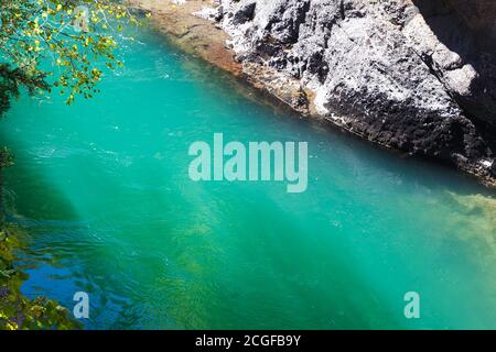 Sunlit emerald whitewater of mountain river Stock Photo - Alamy