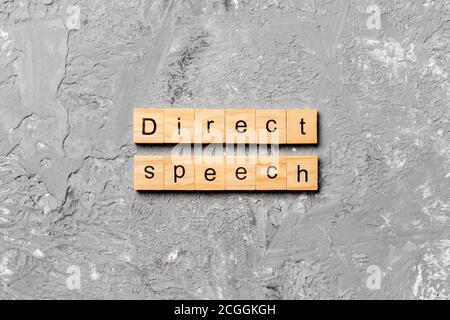 direct speech word written on wood block. direct speech text on cement ...