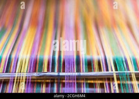 Colorful threads on a loom for traditional Panja dhurrie weaving ...