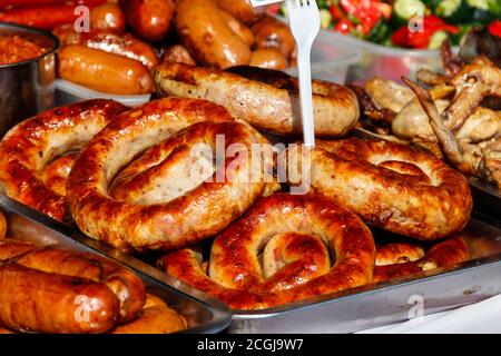 Assortment of grilled sausages for sale. Street food, fast food Stock ...