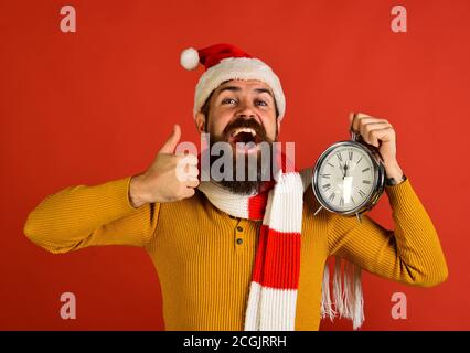 Santa Claus waits for New Year on red background Stock Photo - Alamy