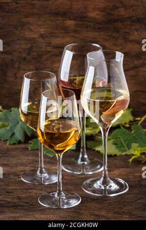 A selective of wine glasses on a wooden table Stock Photo - Alamy