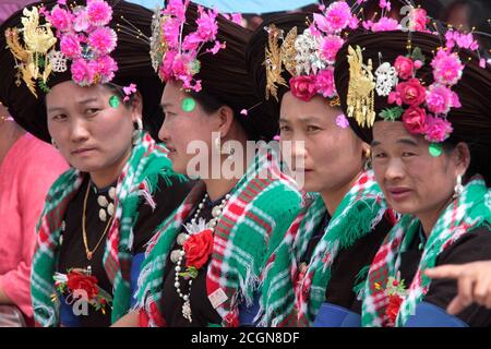 Achang women in traditional costume, at a village dance competition ...
