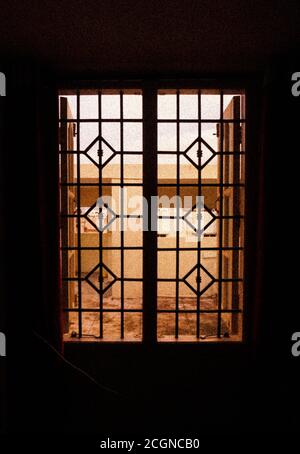 light throung the window at a yellow evening Stock Photo - Alamy
