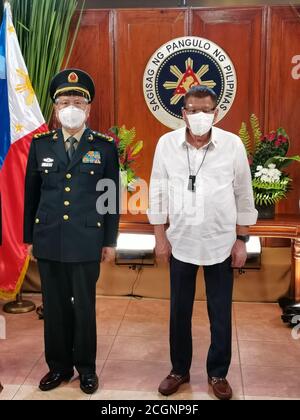 Philippine President Rodrigo R. Duterte smiles as he views two custom ...