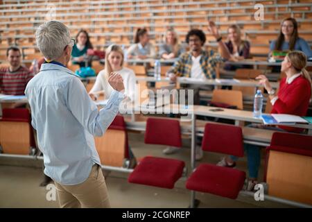 Lecturer and students in a university amphitheatre classroom Stock ...