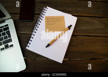 SDG or Sustainable development goals concept. Human hand stacking ...