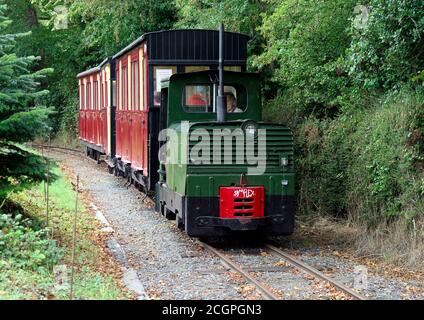Narrow gauge Simplex industrial loco attached to passenger carriage ...