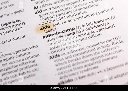 The word or phrase Aide in a dictionary highlighted with marker Stock ...