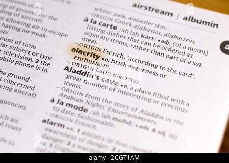 The word or phrase Alacrity in a dictionary highlighted with marker ...