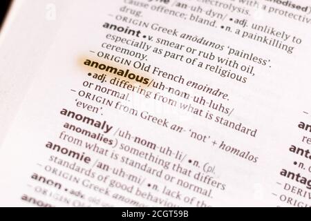 The word or phrase Anomalous in a dictionary highlighted with marker ...