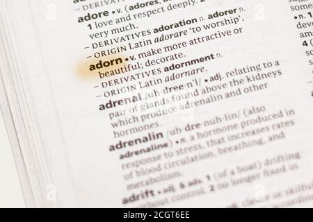 The word or phrase Adorn in a dictionary highlighted with marker Stock ...