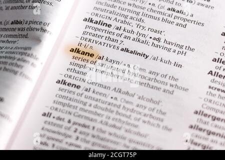 The word or phrase Alkane in a dictionary highlighted with marker Stock ...