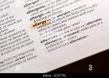The word or phrase Allergy in a dictionary highlighted with marker ...