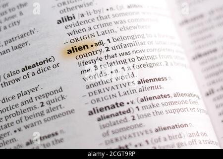 The word or phrase Alien in a dictionary highlighted with marker Stock ...