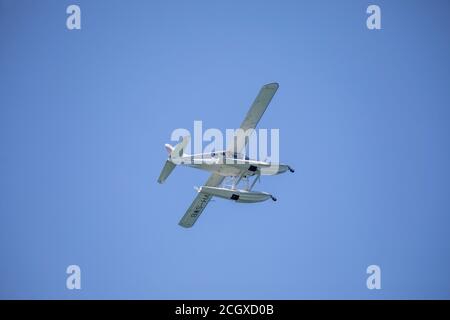 Sydney seaplane flies towards Palm beach Sydney against blue background ...