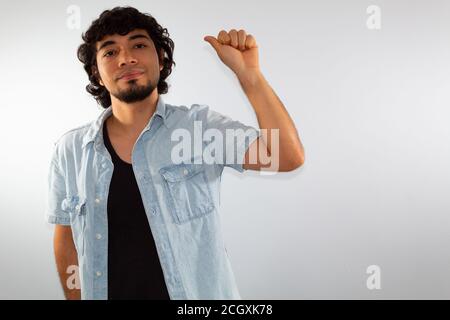 young hispanic deaf man using sign language to communicate, on a white ...