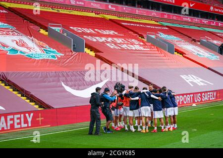 Leeds United players have a team huddle before the game during the ...