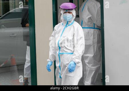A Coruna-Spain -August 18, 2020: A health worker uses a PCR test (mouth ...