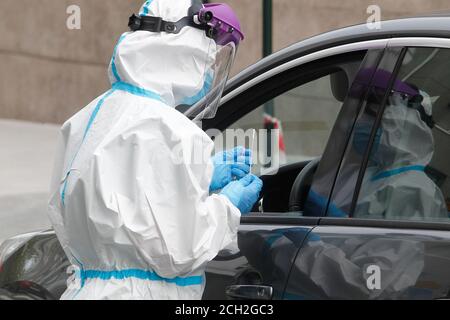 A Coruna-Spain -August 18, 2020: A health worker uses a PCR test (mouth ...