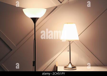 Glowing lamps in dark room Stock Photo - Alamy