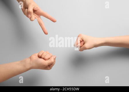 People playing roshambo game Stock Photo - Alamy