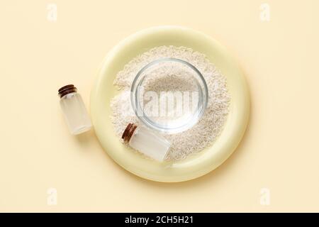 Bottles of rice water on color background Stock Photo - Alamy