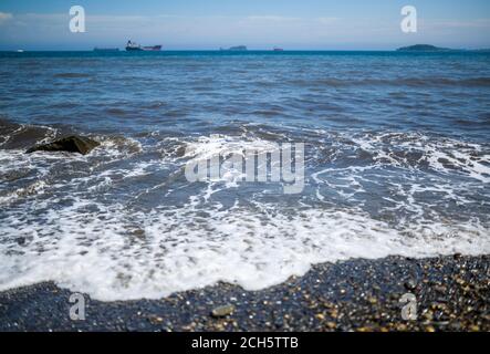 Waves at the seashore. Selective focus with shallow depth of field ...