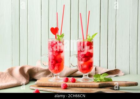 Cups of cold raspberry tea on table Stock Photo - Alamy