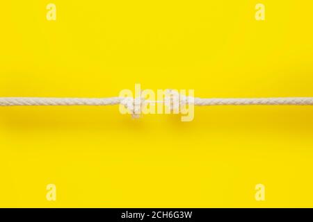 Frayed rope on color background Stock Photo - Alamy