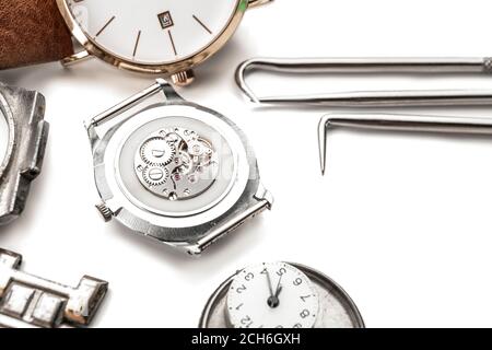 Watches and tools for repair on white background Stock Photo - Alamy