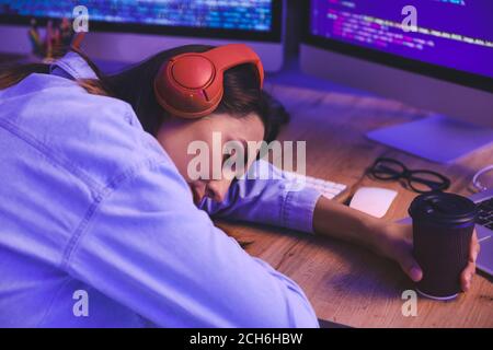 Female programmer sleeping in office at night Stock Photo - Alamy