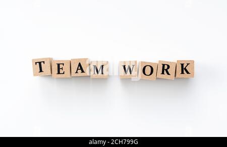 TEAMWORK word written on wood block with wood pencils on wooden ...