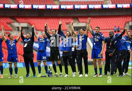 AFC Wimbledon players celebrate after the Sky Bet League Two play off ...