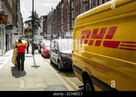 DHL express delivery van on parked the street. UK Stock Photo - Alamy
