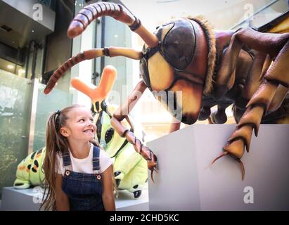 EDITORIAL USE ONLY Eva Riddell, aged 6, interacts with a lifelike model ...