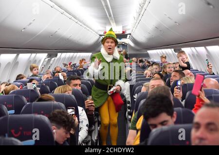 EDITORIAL USE ONLY A Buddy the Elf lookalike checks-in as TUI Airways ...