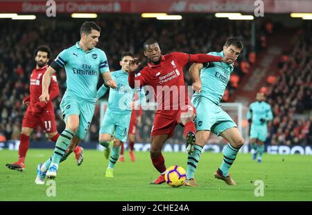 Liverpool's Georginio Wijnaldum (left) and Arsenal's Willian battle for ...