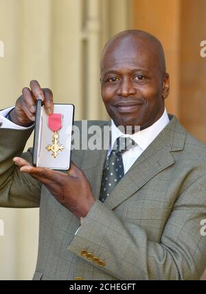 Detective Sergeant Isaac Idun with his OBE following an investiture ...