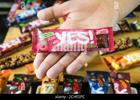 A selection of Nestle YES! snack bars wrapped in recyclable paper is ...