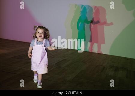 Leora (no last name given) looks into a convex glass mirror during the ...