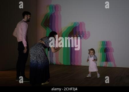 Leora (no last name given) looks into a convex glass mirror during the ...