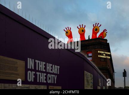 Riggers complete final checks on a giant monster inflatable, created by ...
