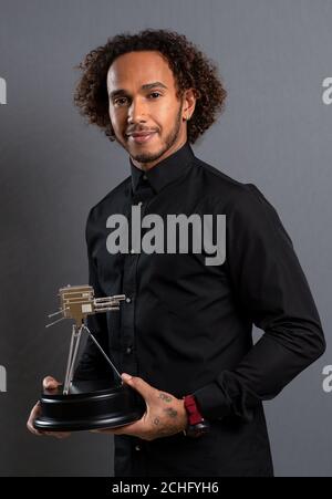 Lewis Hamilton posing for a picture with his second-placed 2019 BBC ...