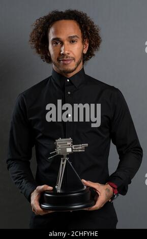Lewis Hamilton posing for a picture with his second-placed 2019 BBC ...