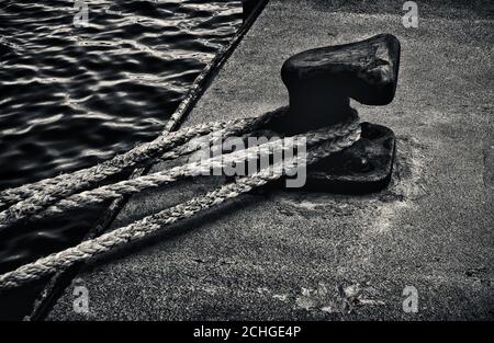 Grayscale shot of the strong ropes knotted on the mooring Stock Photo ...