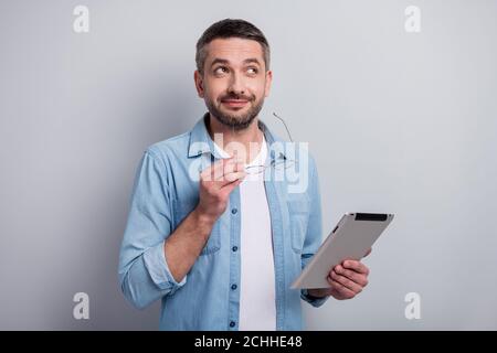Close-up curious dreamy creative redhead female working project ...