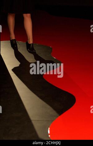 A visitor walks past an installation by artist Cecilia Vicuna from ...